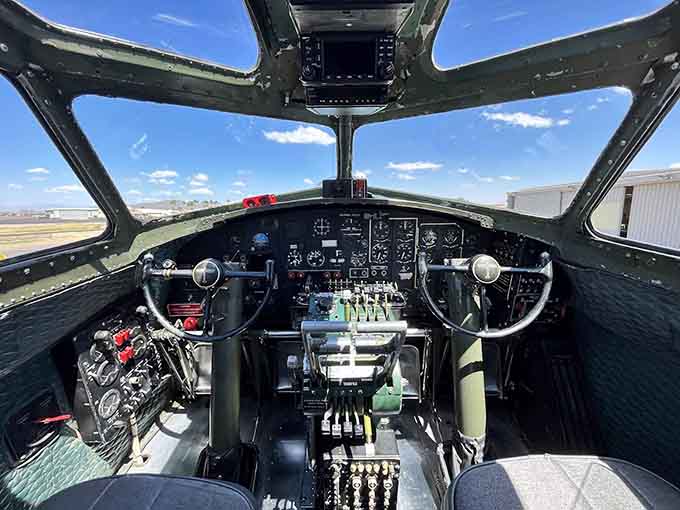 Peer into this cockpit and imagine the steady hands that once gripped these controls during history's most pivotal aerial battles.
