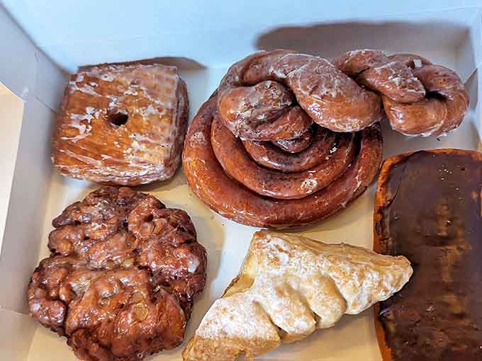 This box of pastry perfection represents hours of craftsmanship. From apple fritters to chocolate-dipped eclairs, each one is a testament to Fray's dedication.