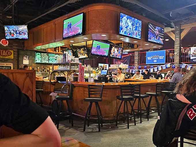 The bar area serves as command central, where craft beers flow and multiple screens ensure no fan is left wondering about the score.