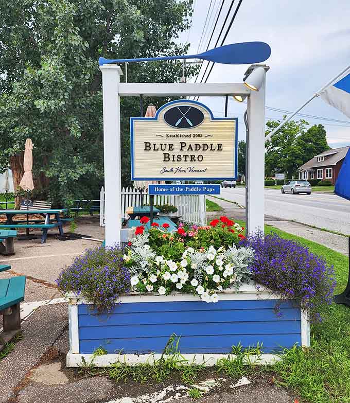 The charming sign welcomes you to a place that's been delighting diners since 2005, complete with flowers that match the restaurant's cheerful spirit.