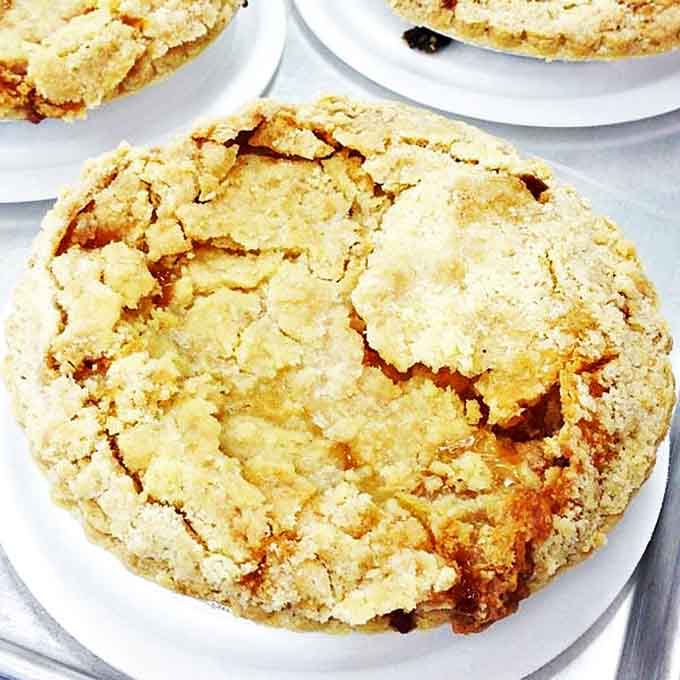 This rustic peach cobbler cookie might not win beauty contests, but its crackly top hides a tender interior that's pure comfort in edible form.