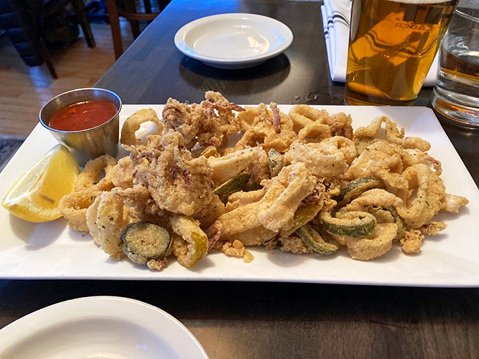 Fried calamari elevated from bar food to art form &ndash; crispy, tender rings and tentacles with zucchini coins adding color and crunch to the party.