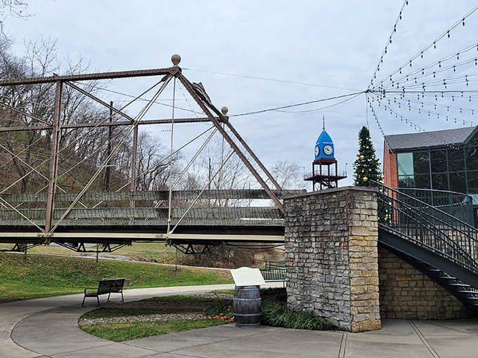 The historic bridge spans more than just water &ndash; it connects visitors to Dayton's industrial past, with the distinctive blue clock tower standing sentinel nearby.