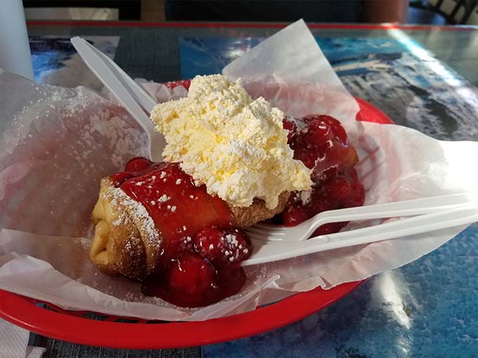 Deep-fried cherry pie topped with ice cream creates that magical hot-cold contrast that makes dessert lovers weak at the knees.
