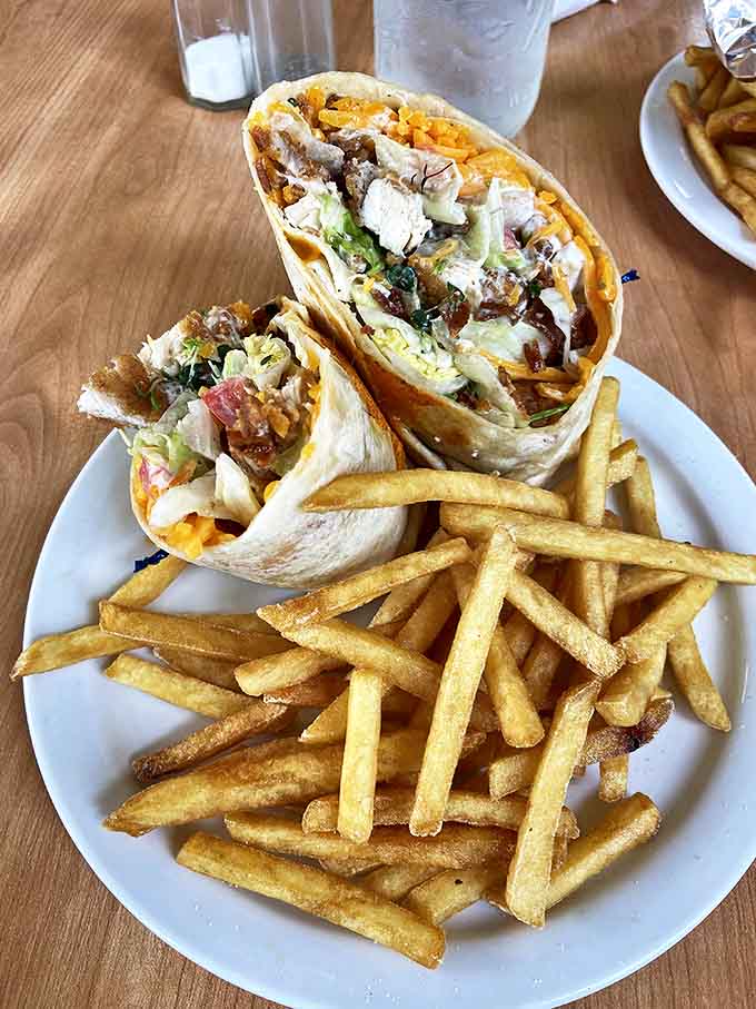 A wrap that solves the eternal lunch dilemma: how to get maximum flavor in a portable package, complete with crispy fries standing at attention.