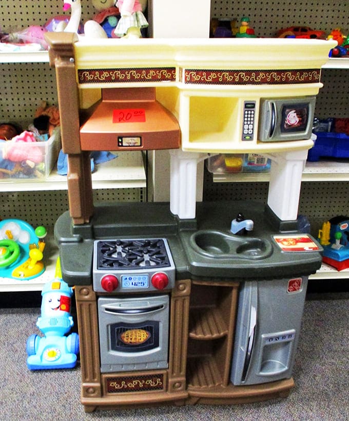 This toy kitchen set has likely hosted countless pretend tea parties and make-believe feasts, ready for a new generation of tiny chefs.