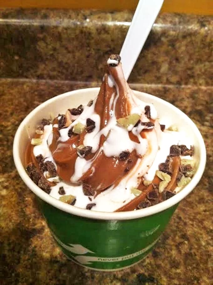 Chocolate drizzle cascading down creamy peaks like a dessert waterfall – proof that sometimes beauty can indeed be delicious.