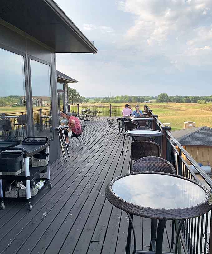 The outdoor patio provides stunning golf course views that transform dinner into a truly memorable Minnesota experience.
