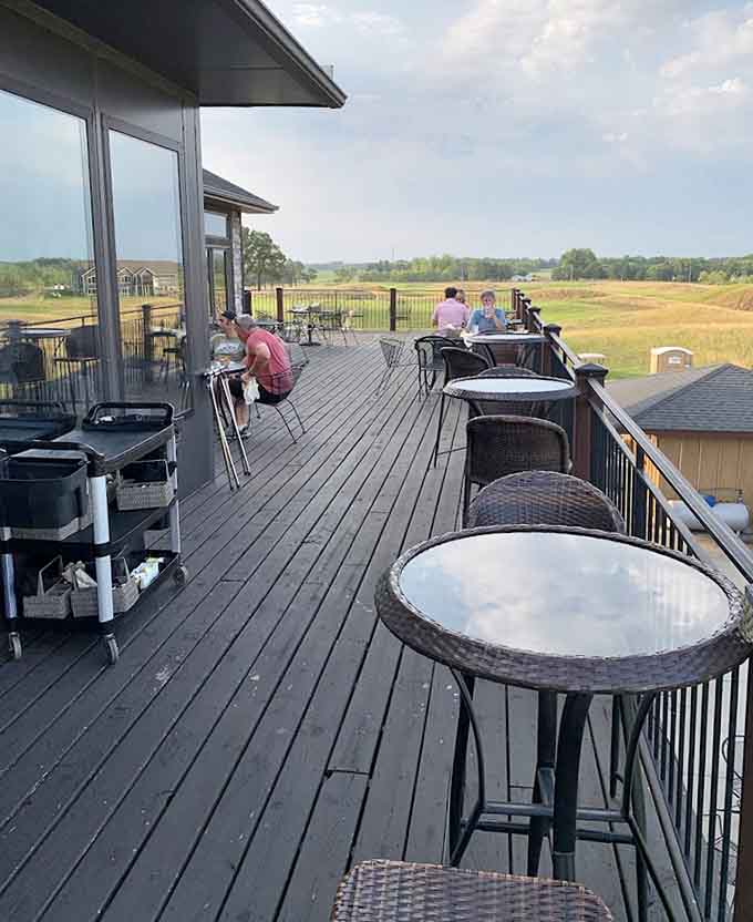 The outdoor deck overlooks rolling fairways, providing that rare combination of excellent food and views worth photographing before eating.