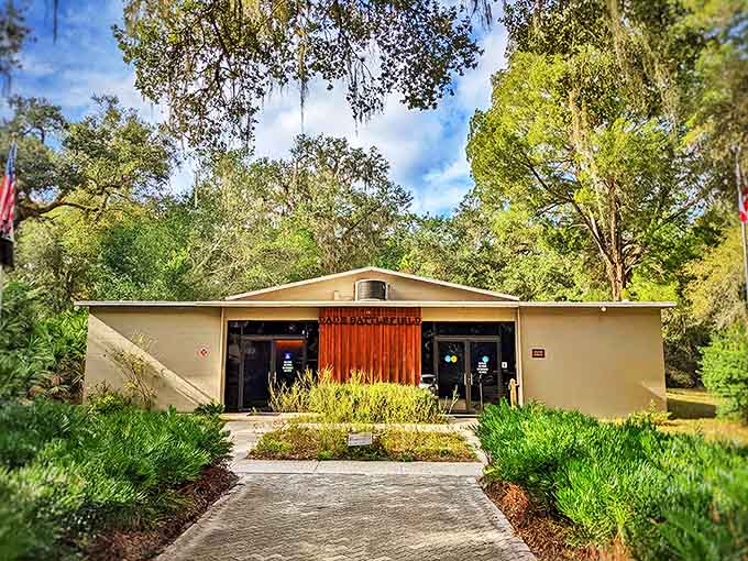The visitor center serves as your gateway to the past, its welcoming fa&ccedil;ade housing treasures that bring Florida's complex history into focus.
