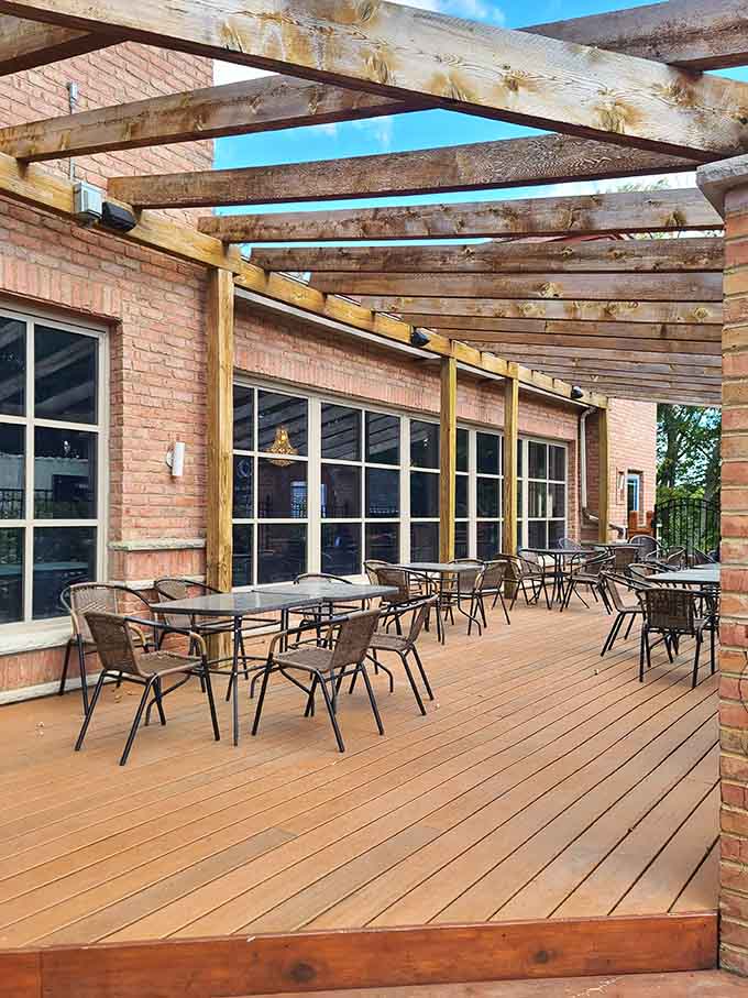 Outdoor seating under wooden beams lets you enjoy Minnesota's nice weather while contemplating your next order of kabobs.