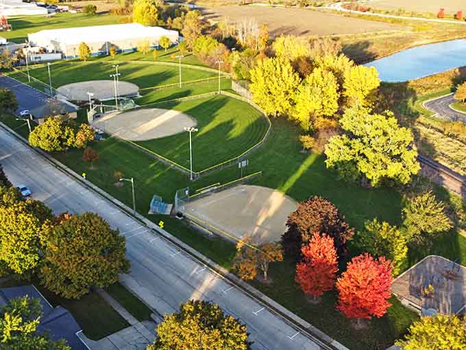 From above, the park's baseball diamonds and walking paths create geometric patterns that reveal the thoughtful planning behind this community recreational space.