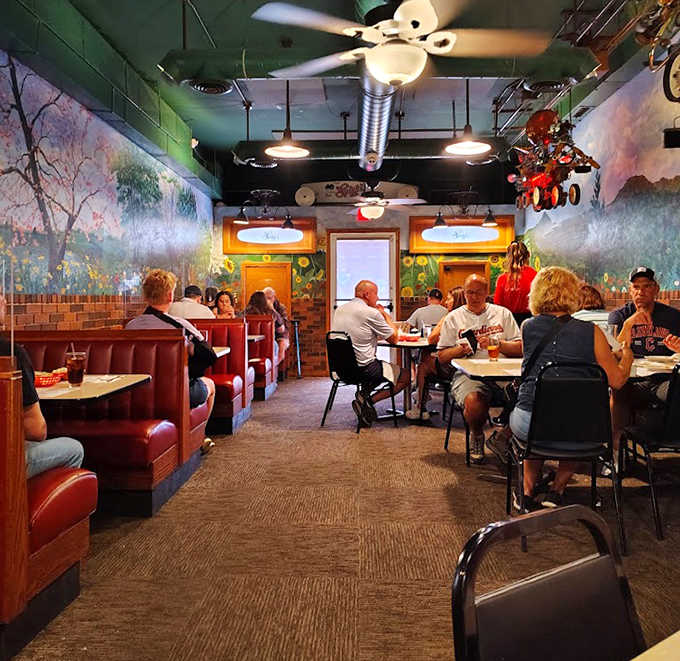 Diners lost in conversation and pasta &ndash; red booths and countryside murals creating the perfect Italian-American tableau.