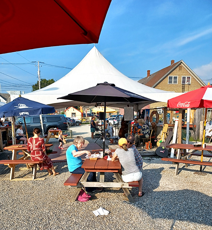 Live music under the tent creates the perfect summer vibe as diners savor their seafood treasures.