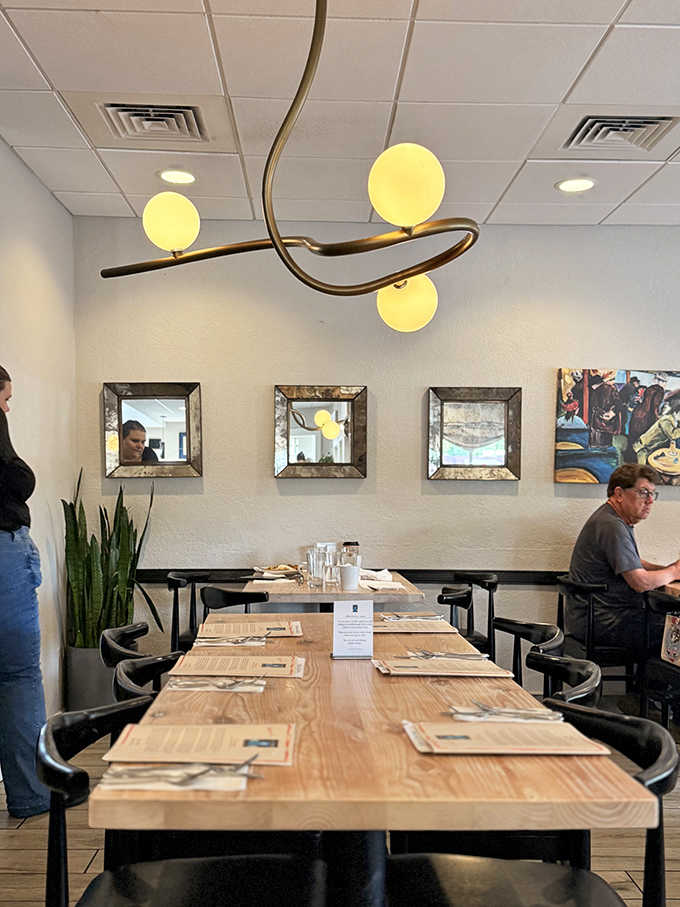 Simple elegance defines the dining space, where modern fixtures and thoughtful touches create an atmosphere that invites you to linger.