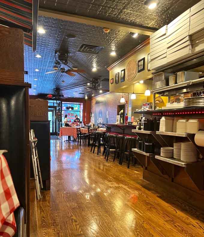 The dining room stretches invitingly, promising plenty of space for your pizza-induced food coma.