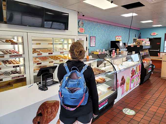 The moment of decision at the counter, where choosing just one thing feels impossible and ordering everything feels justified.