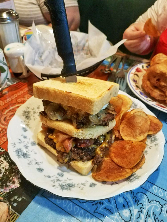 The burger that requires jaw exercises before attempting! Two beef patties playing nicely with bacon, cheese, and all the fixings.