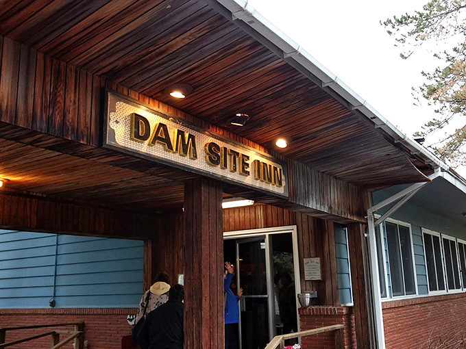 The wooden entrance beckons hungry travelers inside. This doorway has welcomed generations of food lovers seeking chicken nirvana.