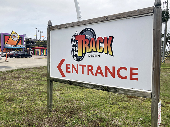 The siren call for speed demons – this unassuming sign marks the entrance to Destin's temple of family-friendly adrenaline.