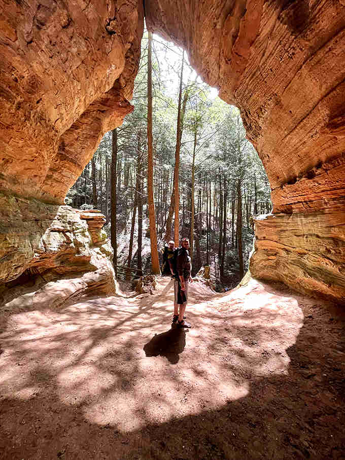 Standing at nature's threshold, this explorer experiences the perfect framing that makes Chapel Cave feel like stepping into another dimension.