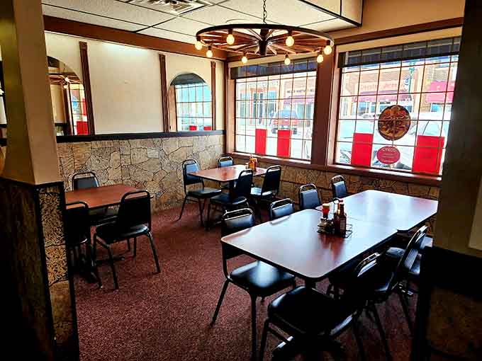 The cozy dining area with its wagon wheel chandelier creates that comfortable small-town restaurant vibe that's becoming increasingly rare.