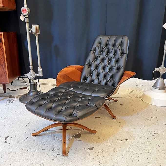 Tufted leather and bent wood creating a chair so comfortable it should come with a warning about never wanting to get up.