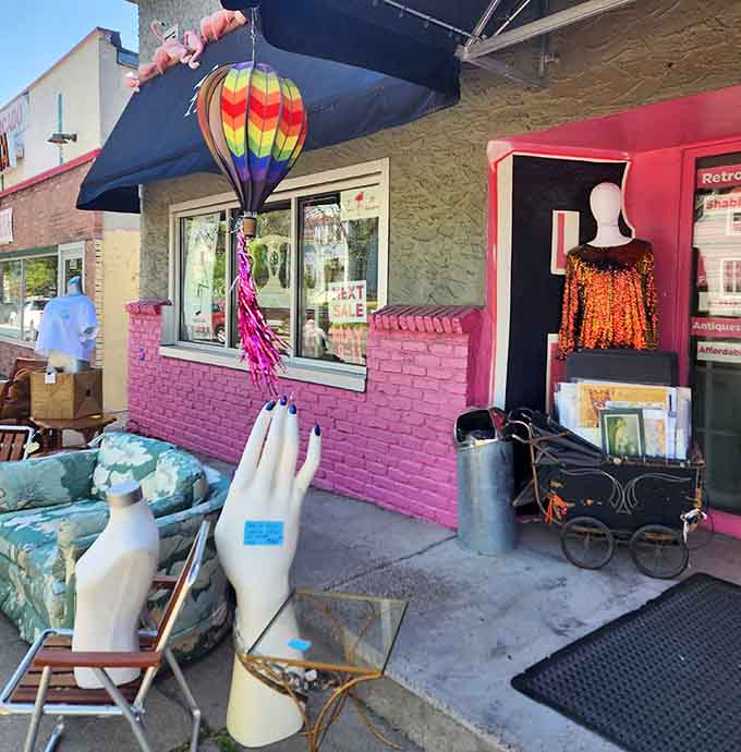 The outdoor display tempts passersby with colorful furniture and quirky finds, making it nearly impossible to walk past without stopping.