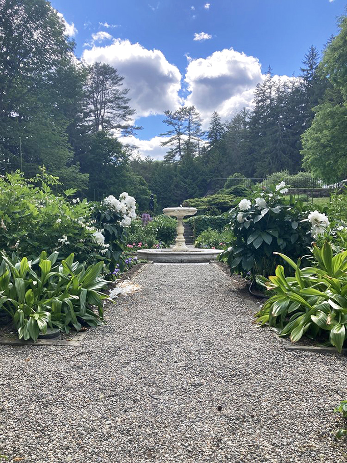 This isn't just a fountain &ndash; it's the centerpiece of a garden sanctuary where time slows down and visitors find themselves involuntarily exhaling stress with each step.