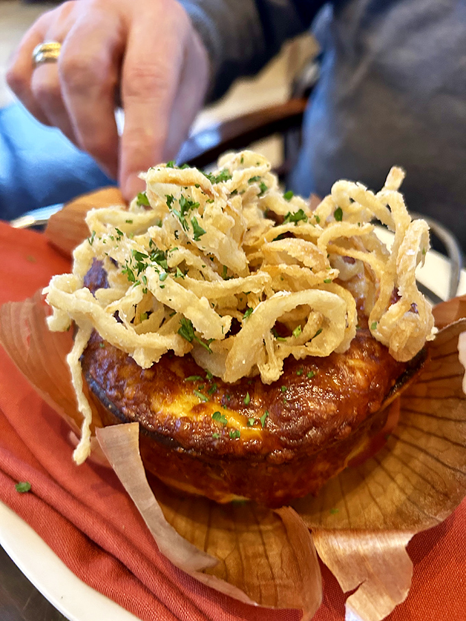 The French onion soup arrives bubbling hot, crowned with a golden cheese cap &ndash; comfort food elevated to art form that warms you from the inside out.