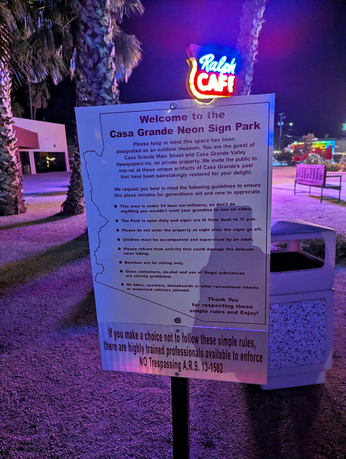 The park's guidelines, illuminated by Ralph's Cafe glow, might contain the most charming museum rule ever: "Don't do anything you wouldn't want your grandma to see on video."