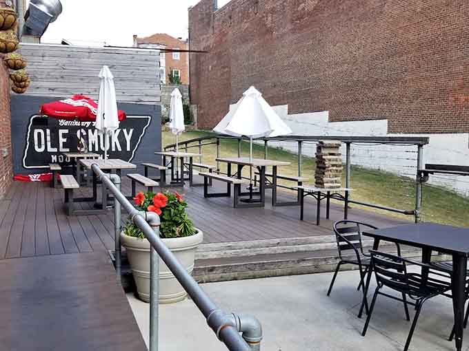 The outdoor patio with Ole Smoky branding offers fresh air dining when Cincinnati weather cooperates beautifully.