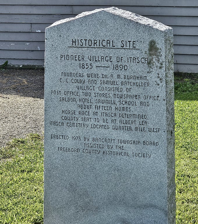 This historical marker grounds the whimsical rock garden in actual pioneer history, reminding visitors that people once built an entire village here before deciding Albert Lea proper looked more promising.