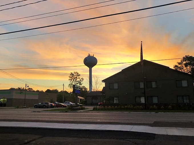 As sunset bathes Holly in golden light, the town's water tower stands sentinel over a community that knows the value of simple pleasures.
