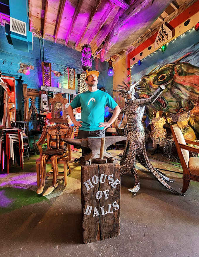 A visitor contemplates the meaning of it all while standing beside one of the gallery's signature creations.