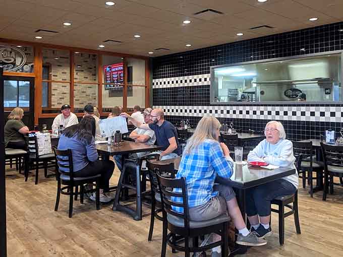 Happy diners enjoying their meals in the relaxed, comfortable atmosphere that keeps people coming back.
