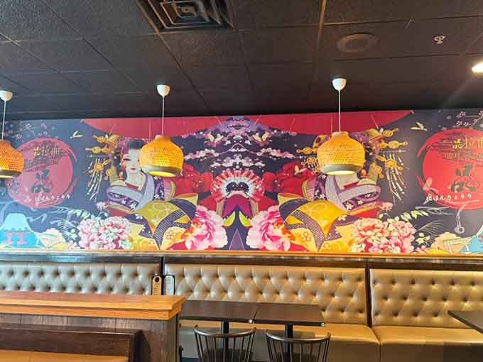 Bold, colorful wall art featuring traditional Japanese motifs adds cultural authenticity and visual appeal to the dining experience here.