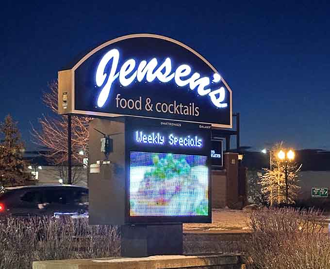 The illuminated sign guides hungry travelers to their destination like a delicious beacon in the night.
