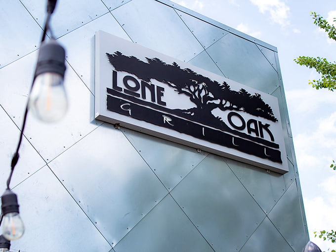 The iconic Lone Oak tree logo stands proud, marking the spot where wing dreams come true.