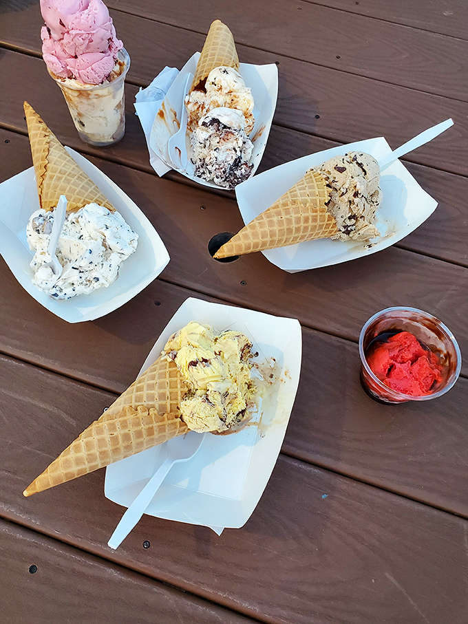 A wooden table transformed into an ice cream social, where multiple flavors create a dessert conversation piece that brings strangers together.