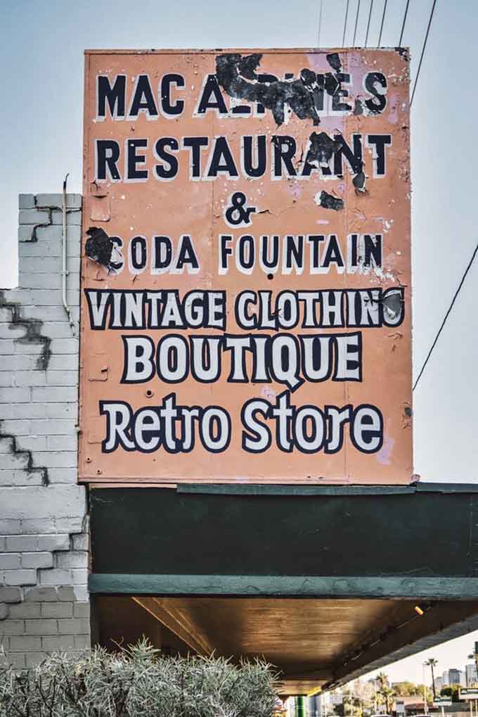 The weathered signage outside announces not just a restaurant but a destination, a place where vintage clothing meets classic eats in perfect harmony.