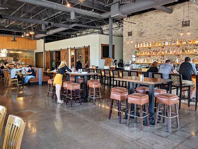 Comfortable booth seating and warm lighting create the kind of atmosphere where you want to linger over dessert and another round.