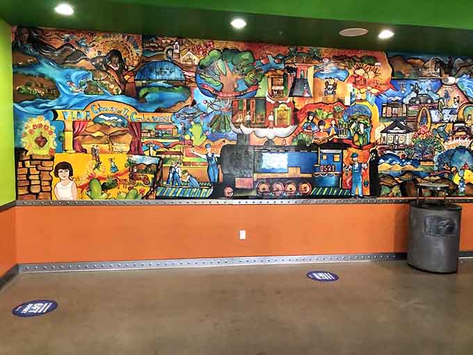 This vibrant mural celebrates Mexican culture and tradition, adding artistic flair to your dining experience with whimsical details.