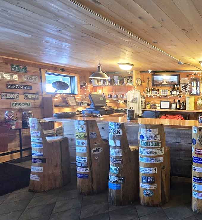The bar area features creative seating made from old posts, proving that rustic charm and clever design make perfect drinking companions.