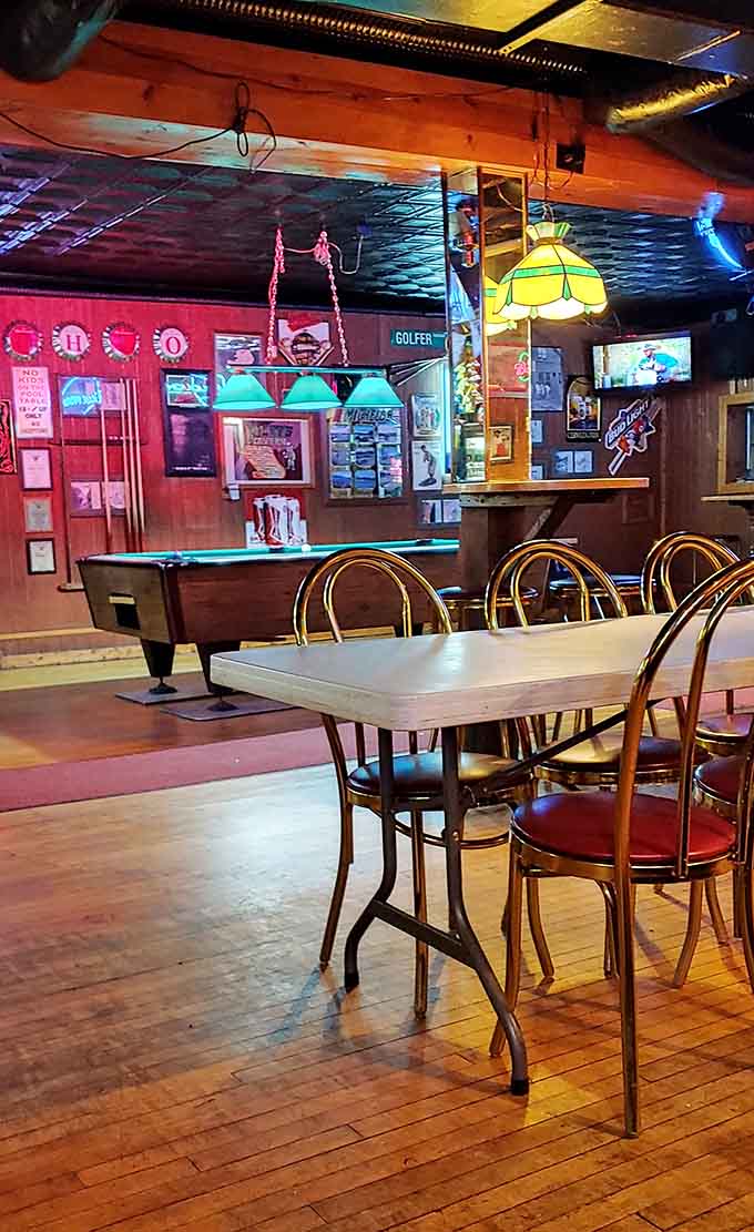 Cozy dining areas with mismatched seating create that lived-in comfort only the best taverns achieve.
