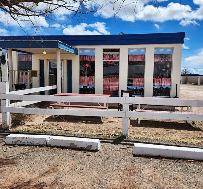 Simple white picket fences frame this slice of Americana &ndash; a patio that invites you to soak up Arizona sunshine with pizza in hand.