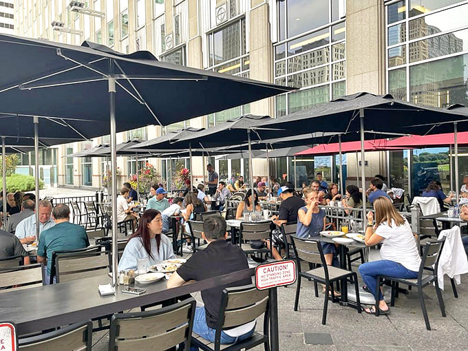 The outdoor seating area offers a perfect perch for people-watching along the Overseas Highway while savoring Keys cuisine.