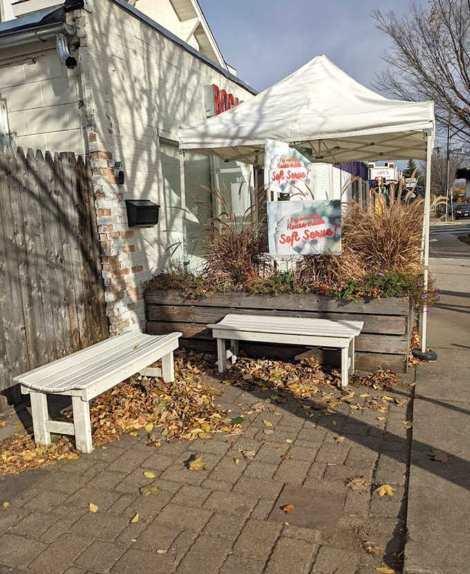 Outdoor Seats: Green metal tables under cheerful yellow umbrellas create the perfect stage for the serious business of ice cream enjoyment.