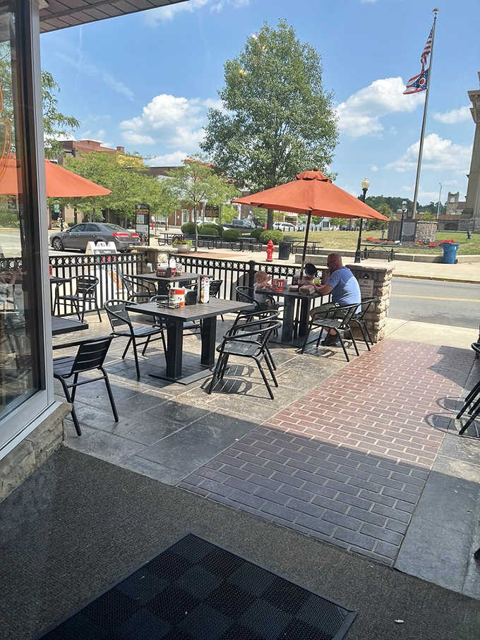 The outdoor patio offers prime people-watching real estate while you contemplate ordering just one more pizza for "research purposes."