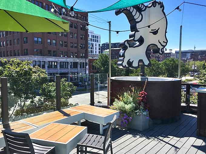 The urban oasis of the outdoor patio provides a perfect perch for people-watching while enjoying creative comfort food under the Little Goat logo.